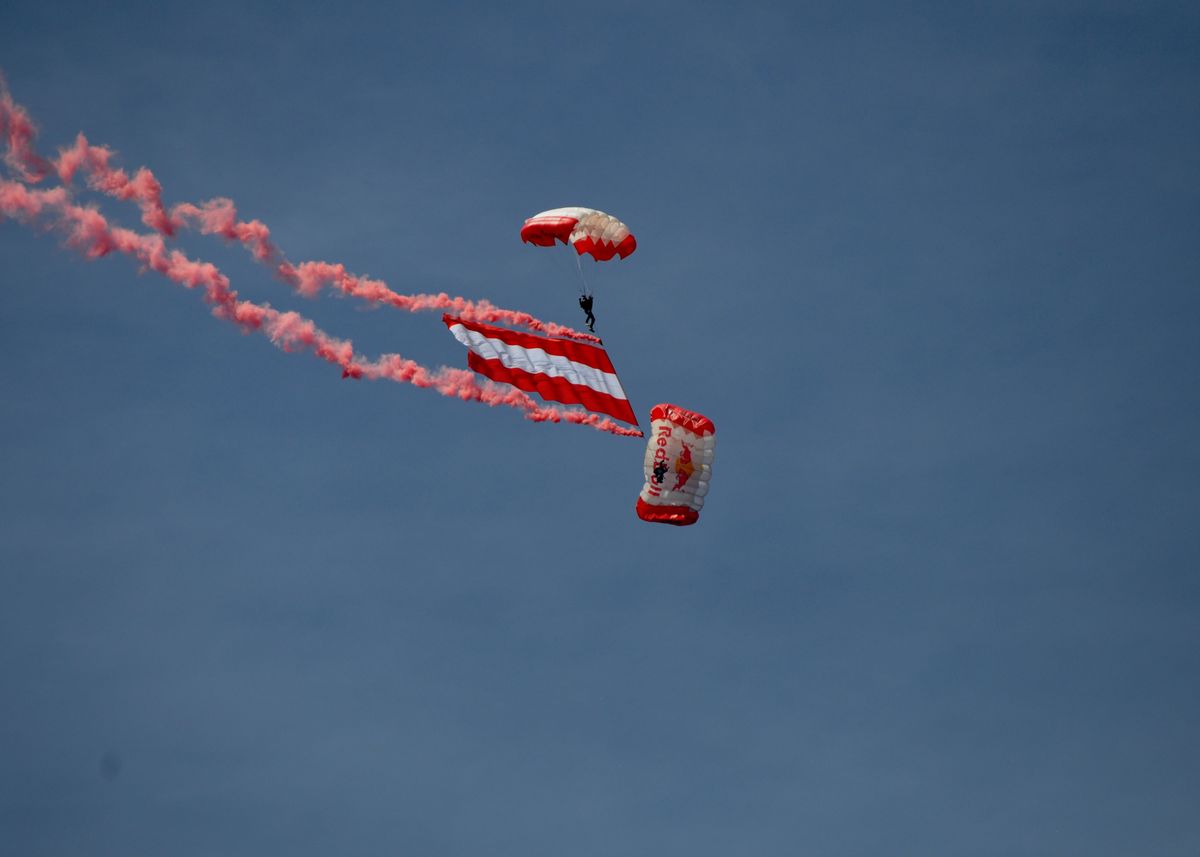 'Skydivers with Red Bull Parachute and Austria Flag' Poster, picture ...