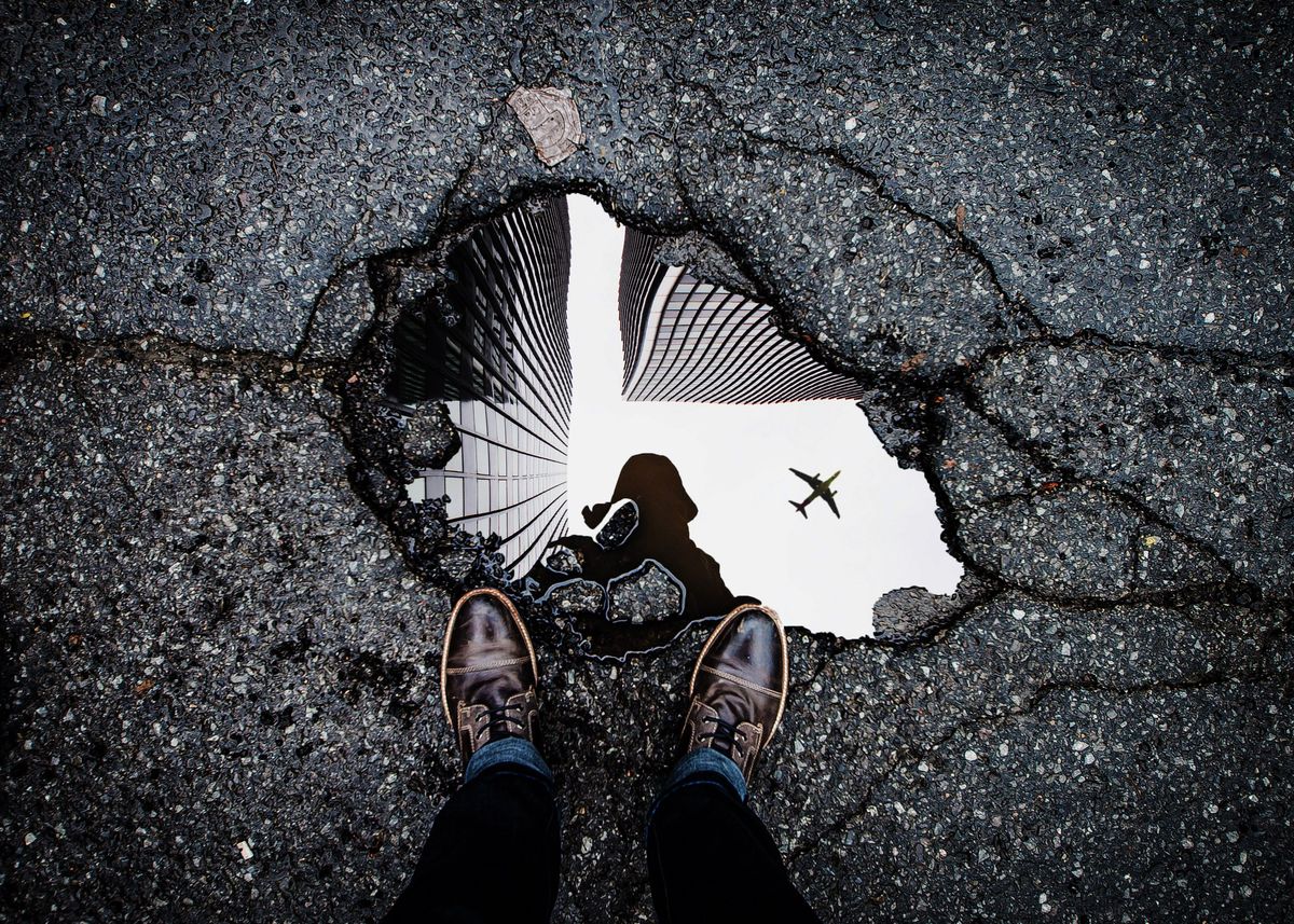 'puddles on potholes' Poster by RZH Creative | Displate