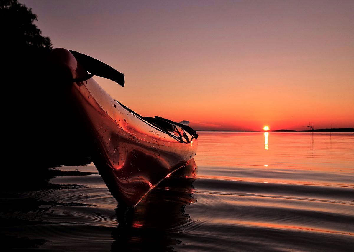 'Kayak in calm water sunset' Poster by Fredrik Lindblom | Displate