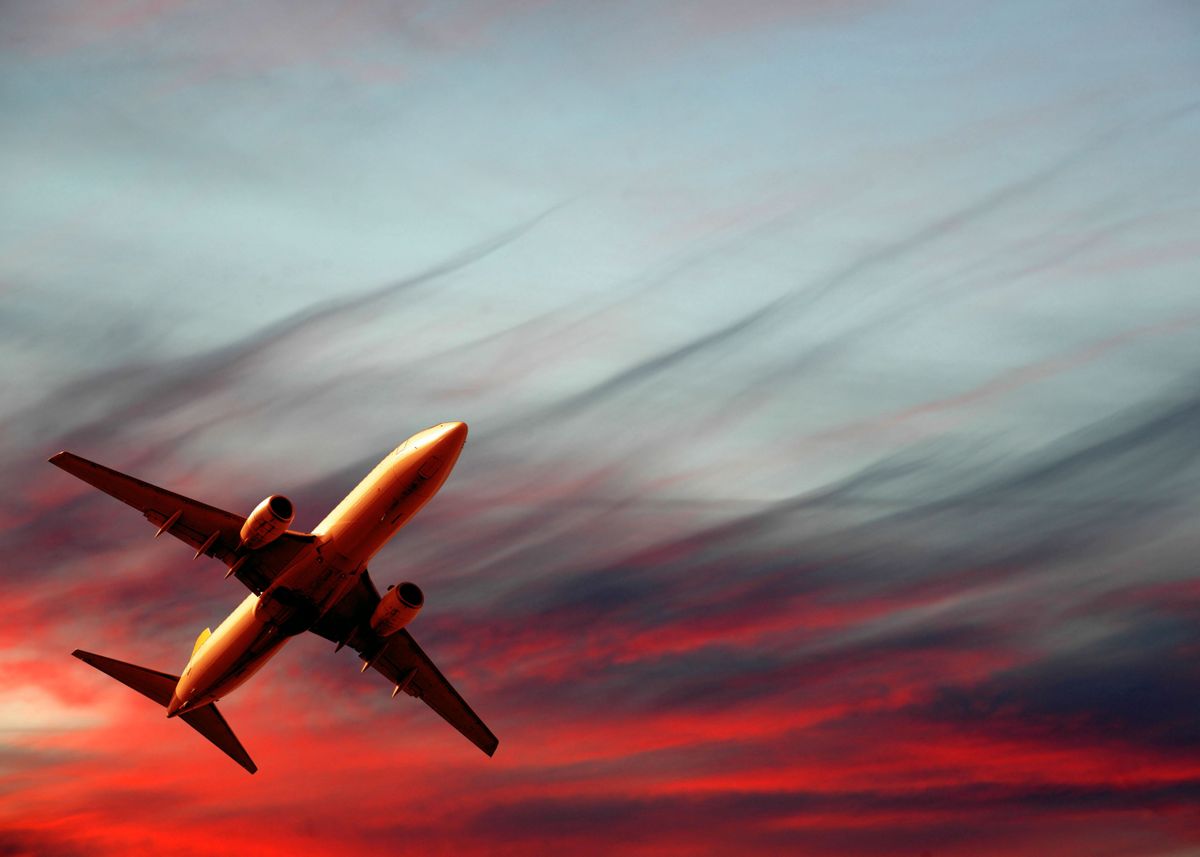 'airplane in orange sky' Poster by sultan | Displate