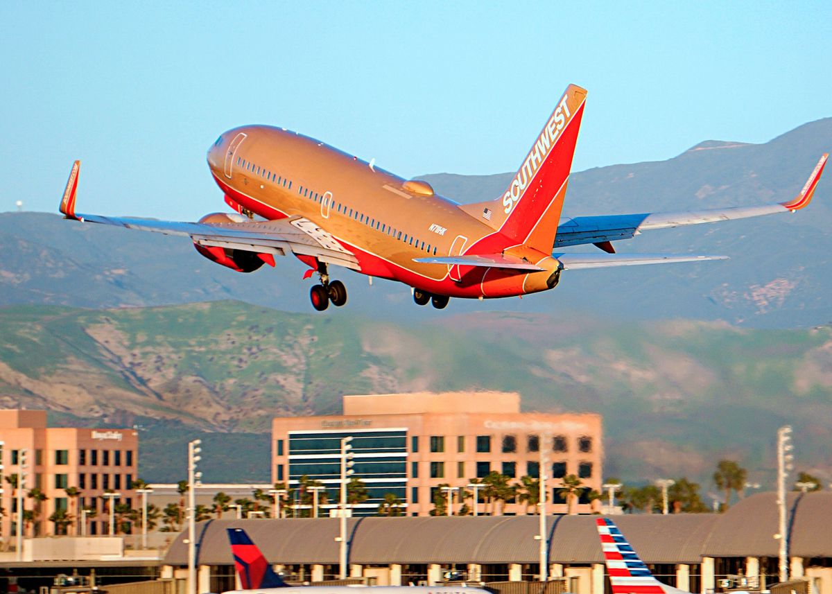 'Retro Southwest 737' Poster by Coby Wayne | Displate